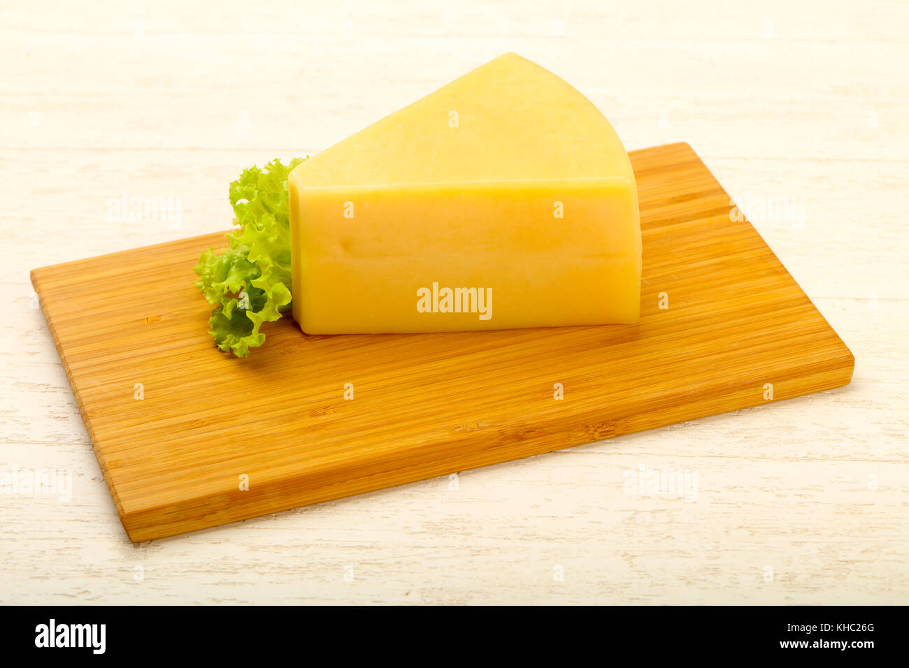 Parmesan cheese triangle Stock Photo - Alamy