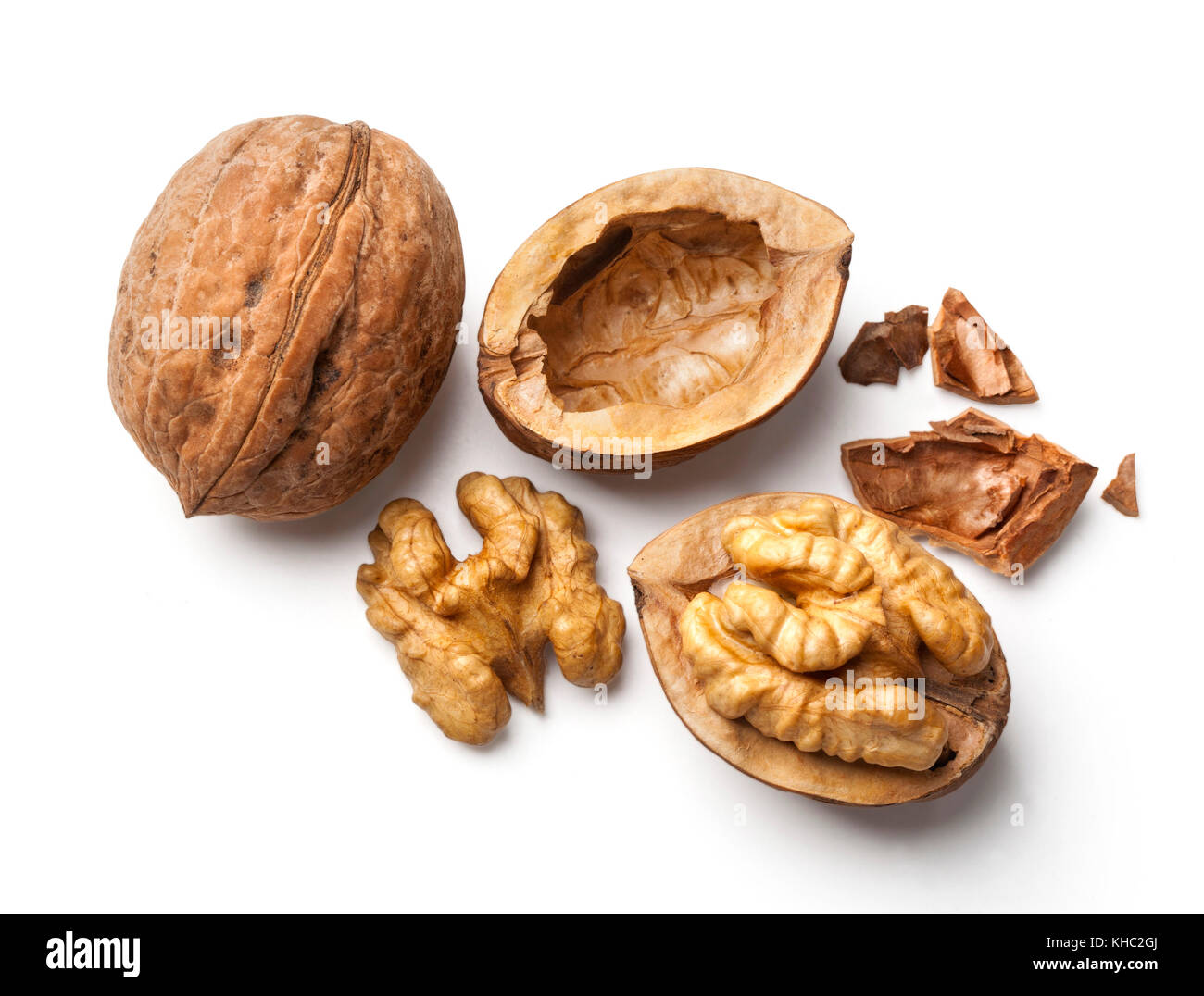 walnut and a cracked walnut isolated on the white background with ...