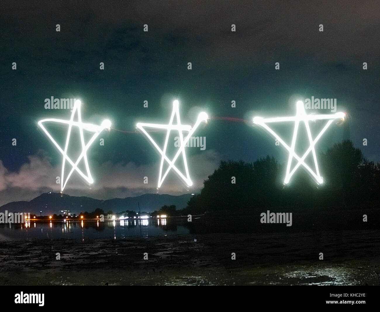star , made from sparkle light paining in the dark night , motion with ...