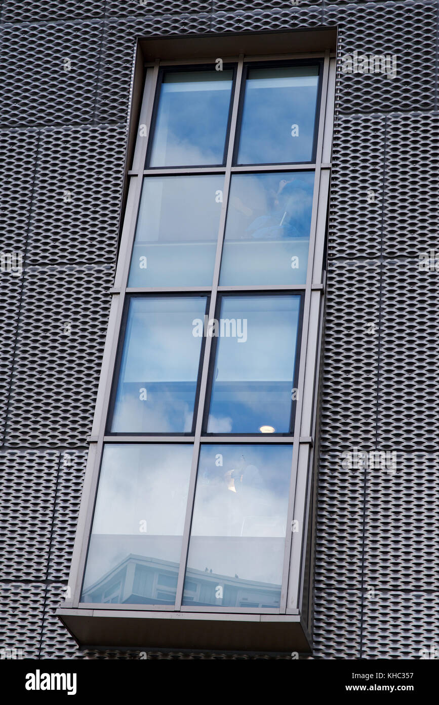 Windows in a modern building with reflections Stock Photo - Alamy