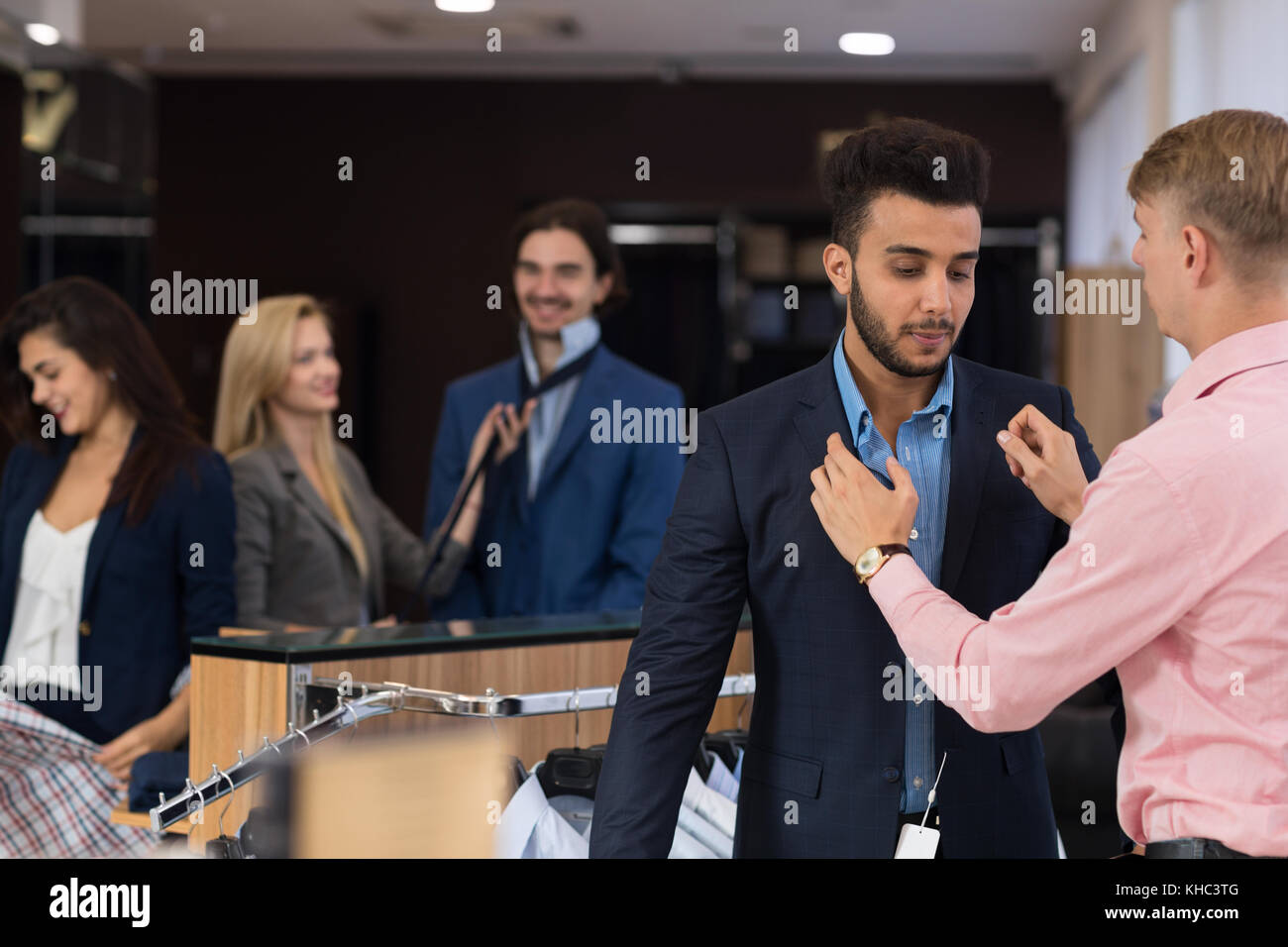 Handsome Business Man On Shopping, Young Male Assistant Helping Buyer ...