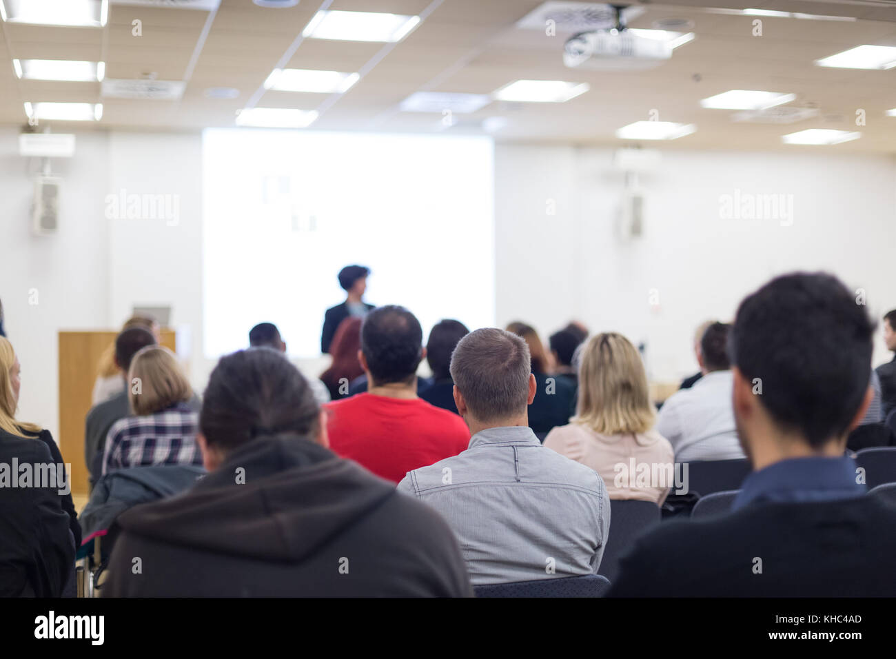 Woman giving presentation on business conference Stock Photo - Alamy
