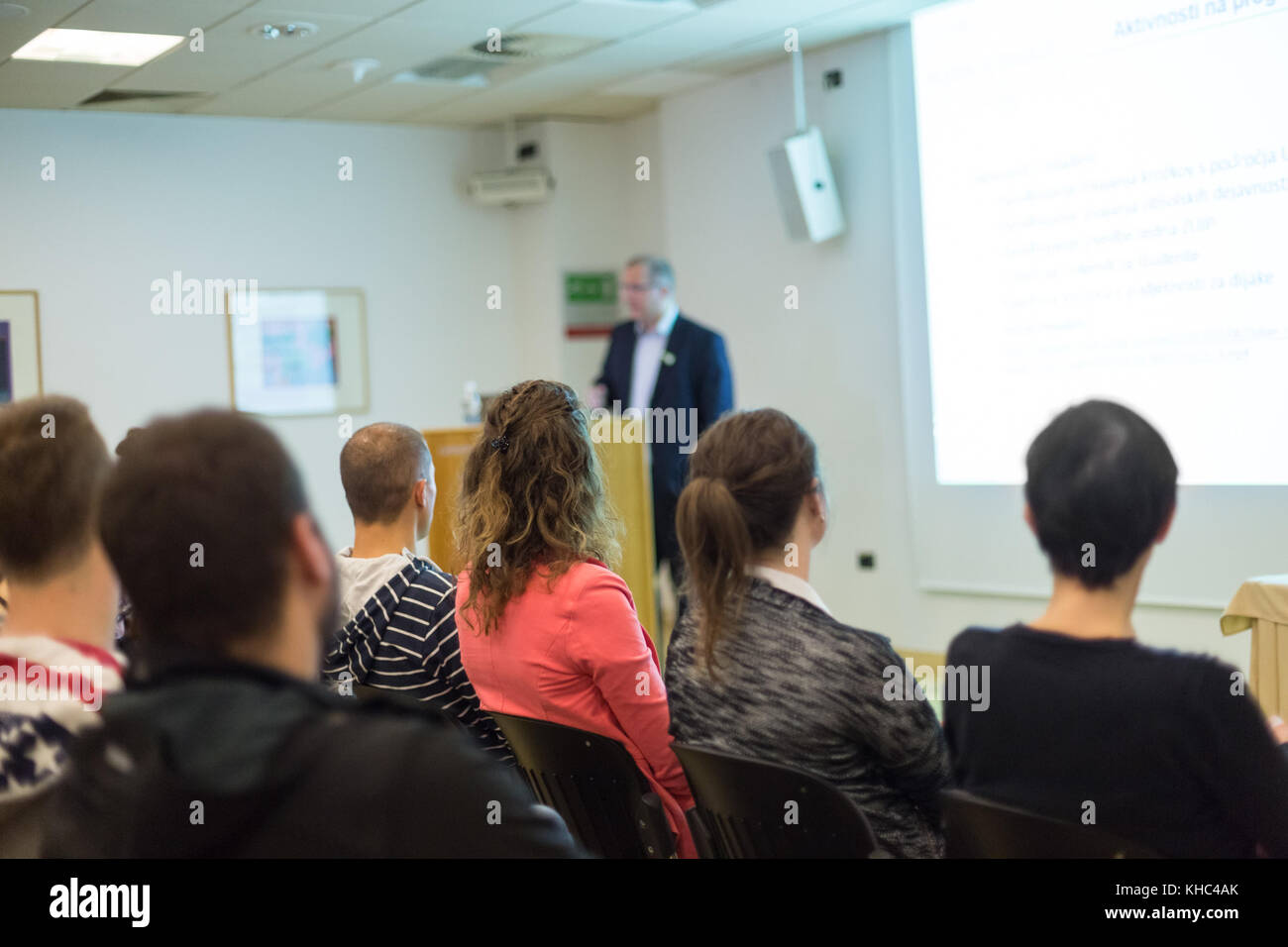 Woman giving presentation on business conference Stock Photo - Alamy