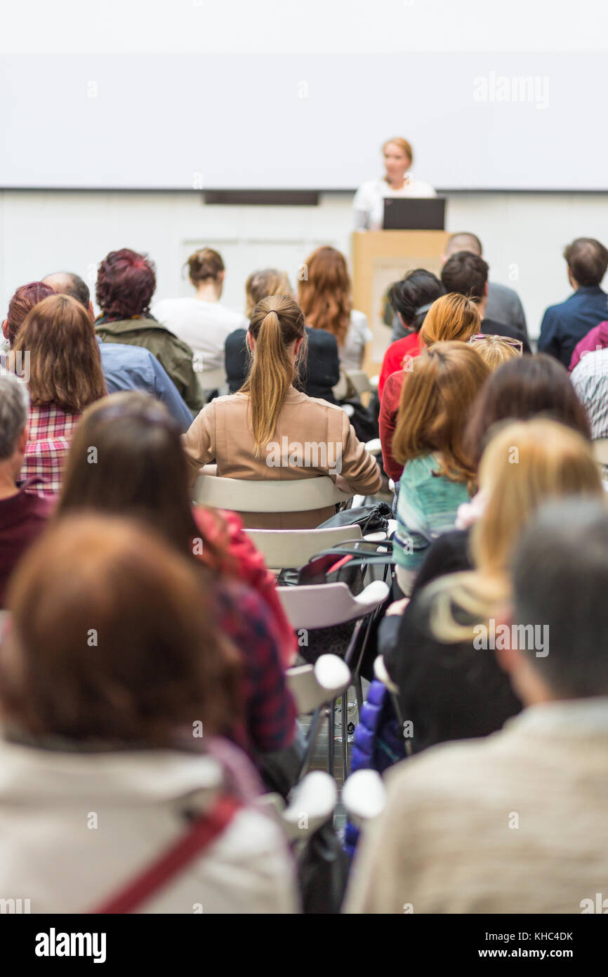 Woman giving presentation on business conference Stock Photo - Alamy