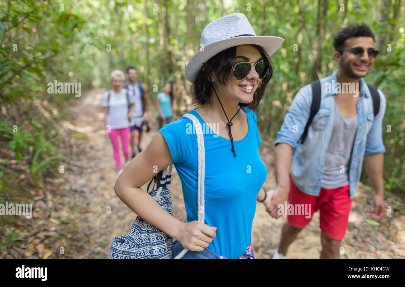 People Group With Backpacks Trekking On Forest Path, Mix Race Young Men ...