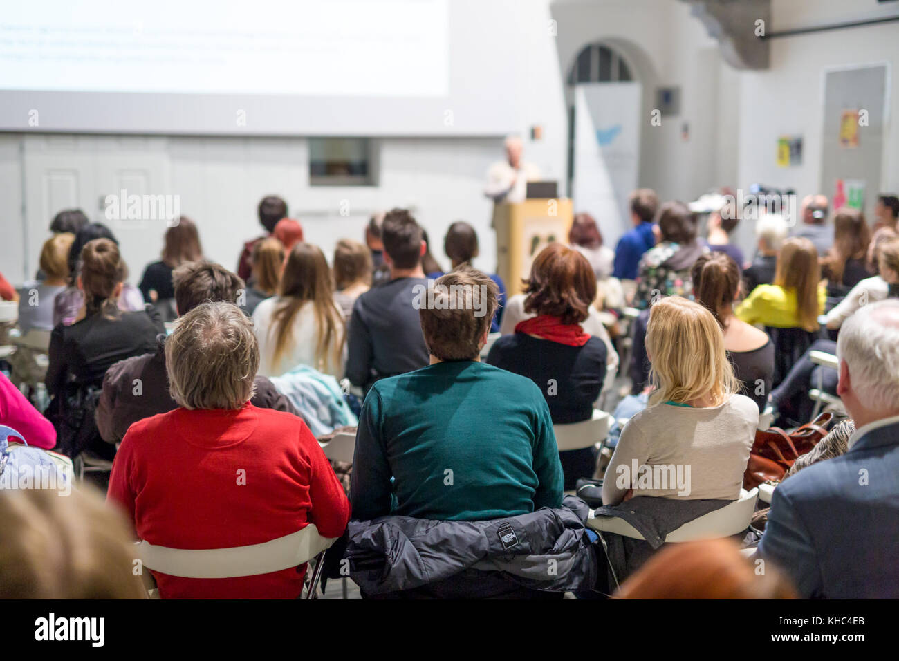 Man giving presentation in lecture hall at university Stock Photo - Alamy