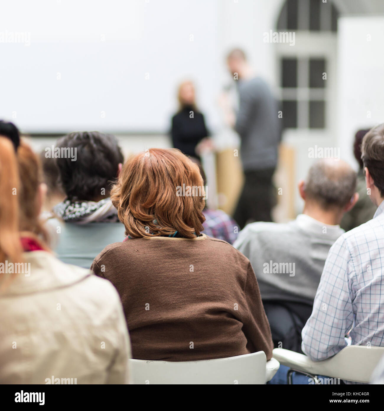 Woman giving presentation on business conference Stock Photo - Alamy