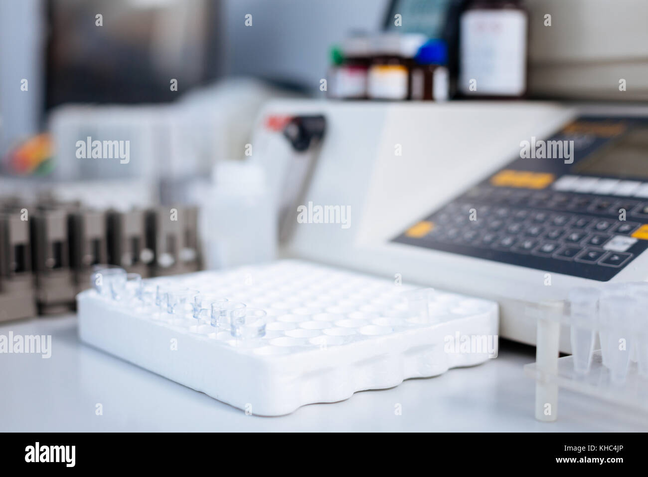 One raw of small test tubes remaining in stand Stock Photo - Alamy