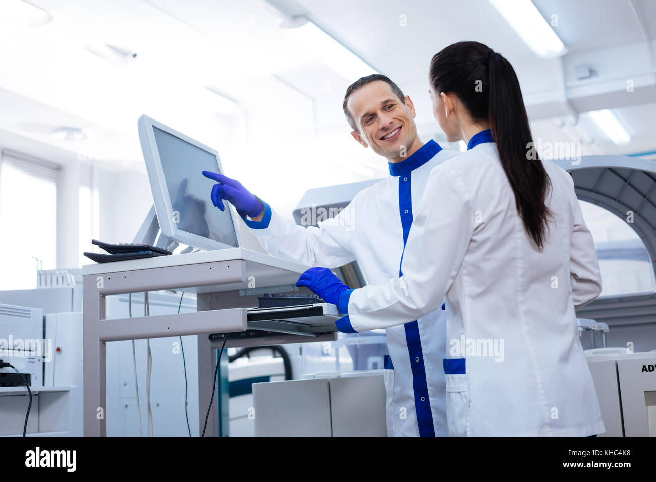Adorable couple of scientists creating magic Stock Photo - Alamy