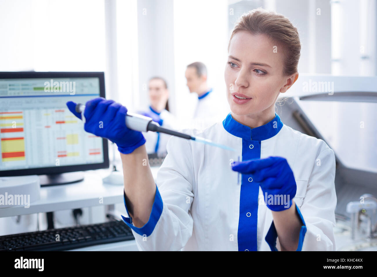 Inspiring attractive laboratorian pleased with results Stock Photo - Alamy