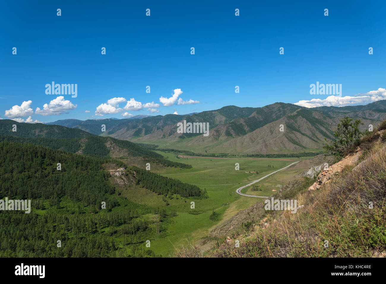 Scenic top view on the valley between the mountains, road, hills ...