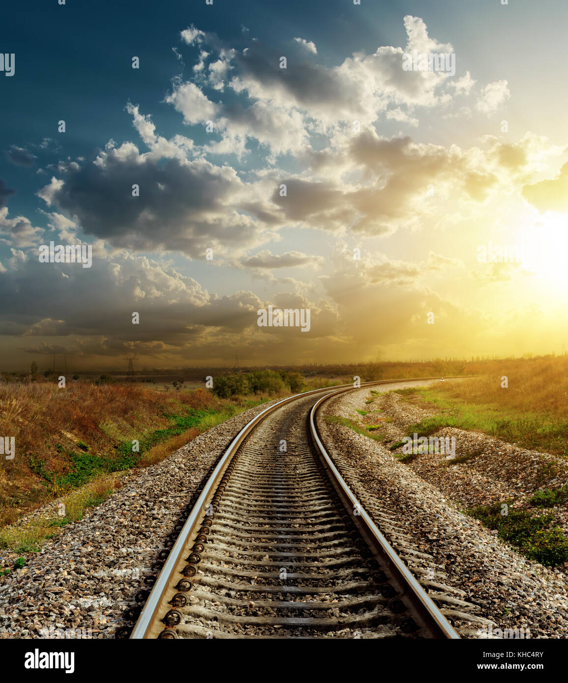 railroad goes to horizon in sunset Stock Photo - Alamy