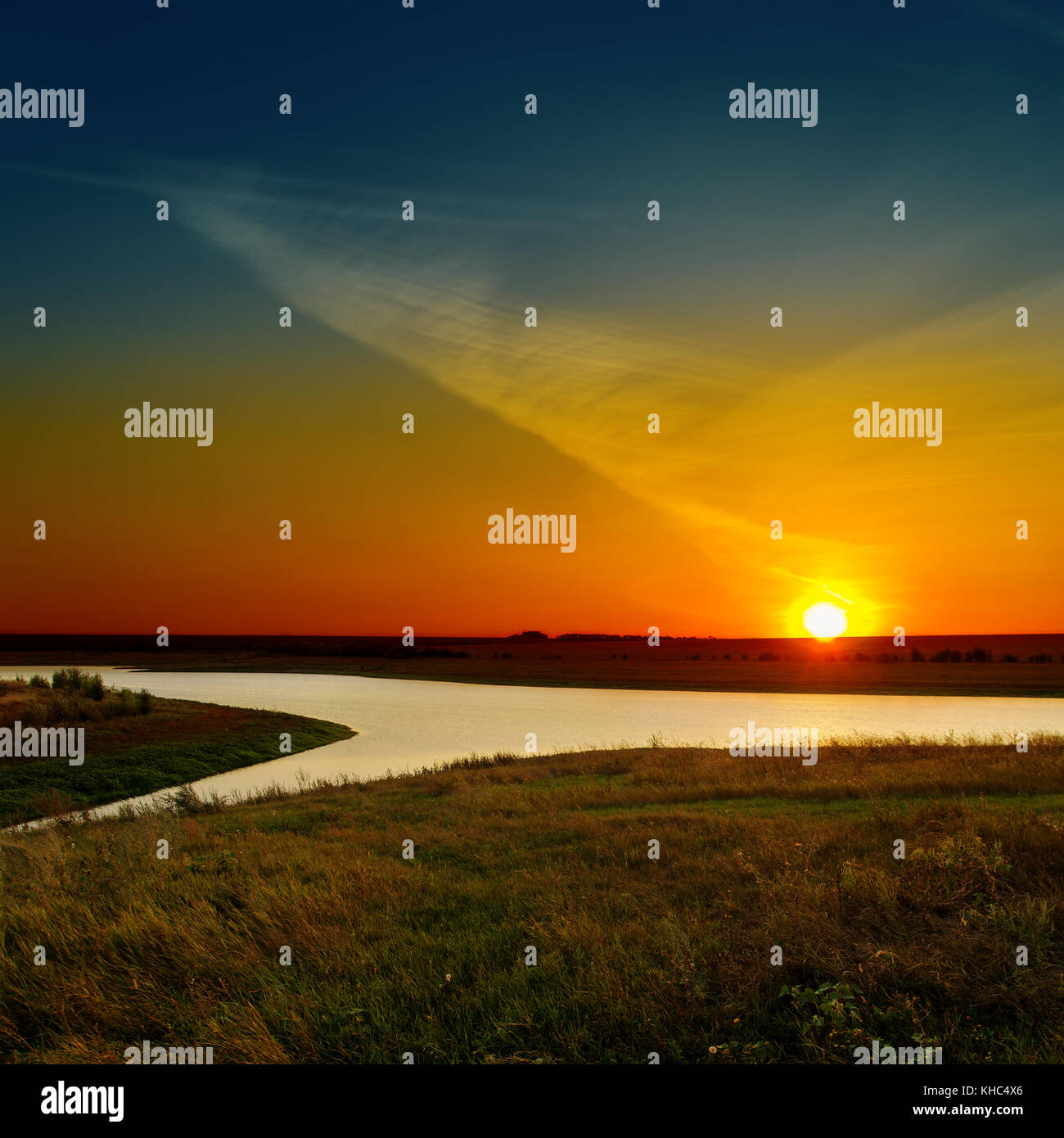 dramatic sunset over river Stock Photo - Alamy