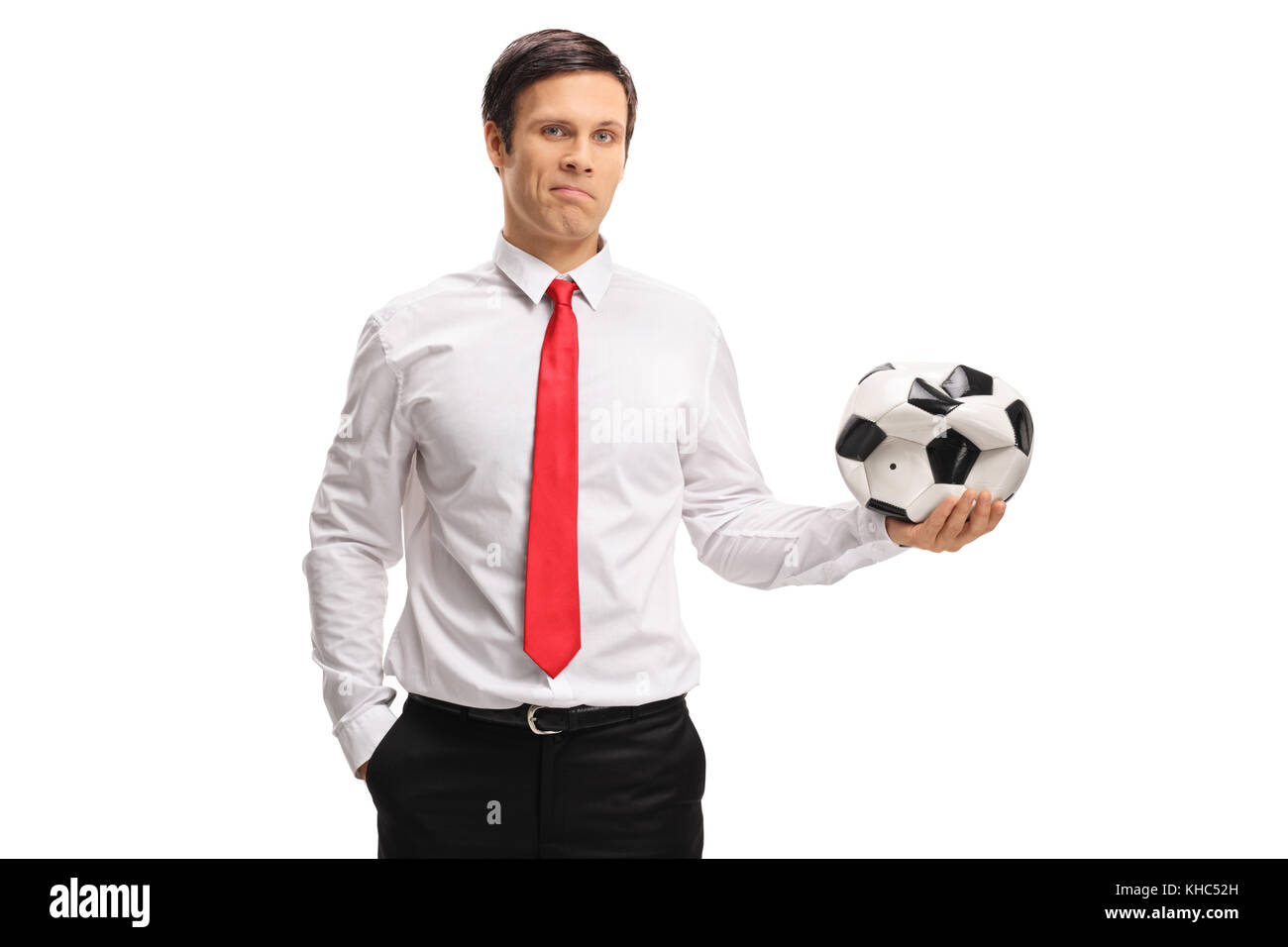 Disappointed formally dressed guy holding a deflated football isolated ...