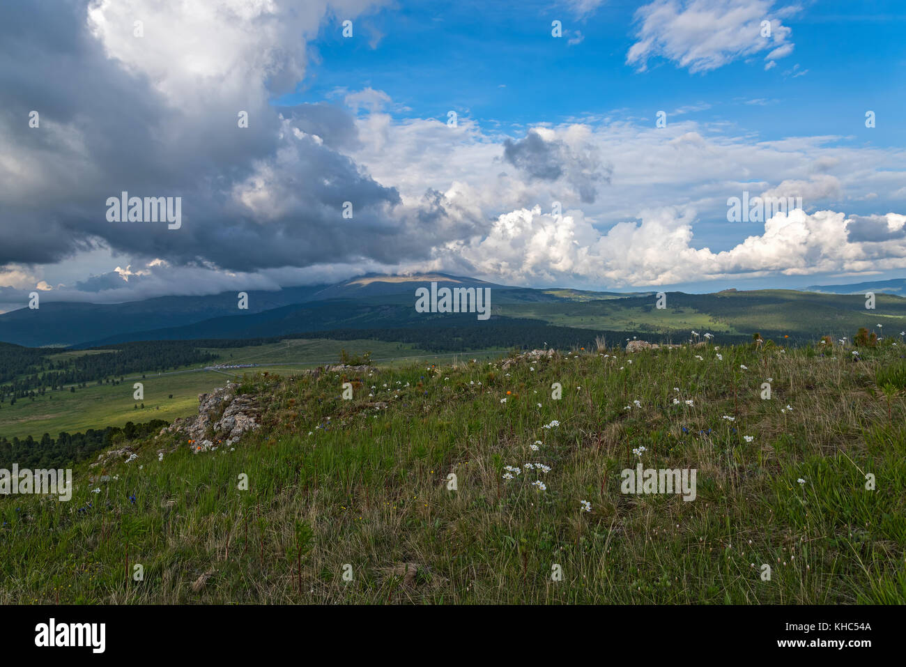 Scenic top view on the valley, forest and mountains on the background ...