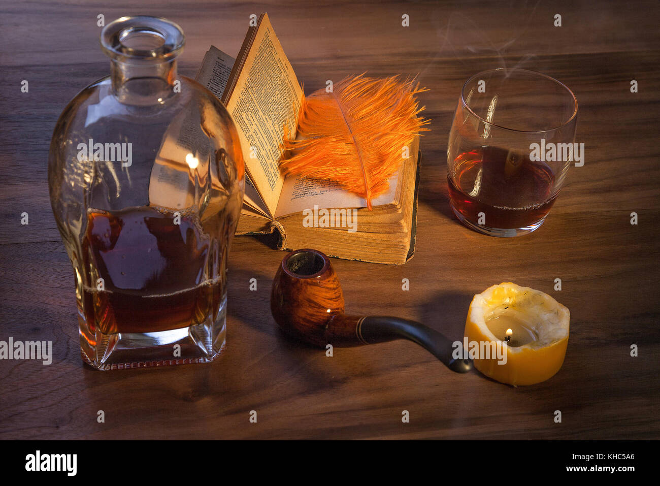 Reading a book with a drink Stock Photo - Alamy