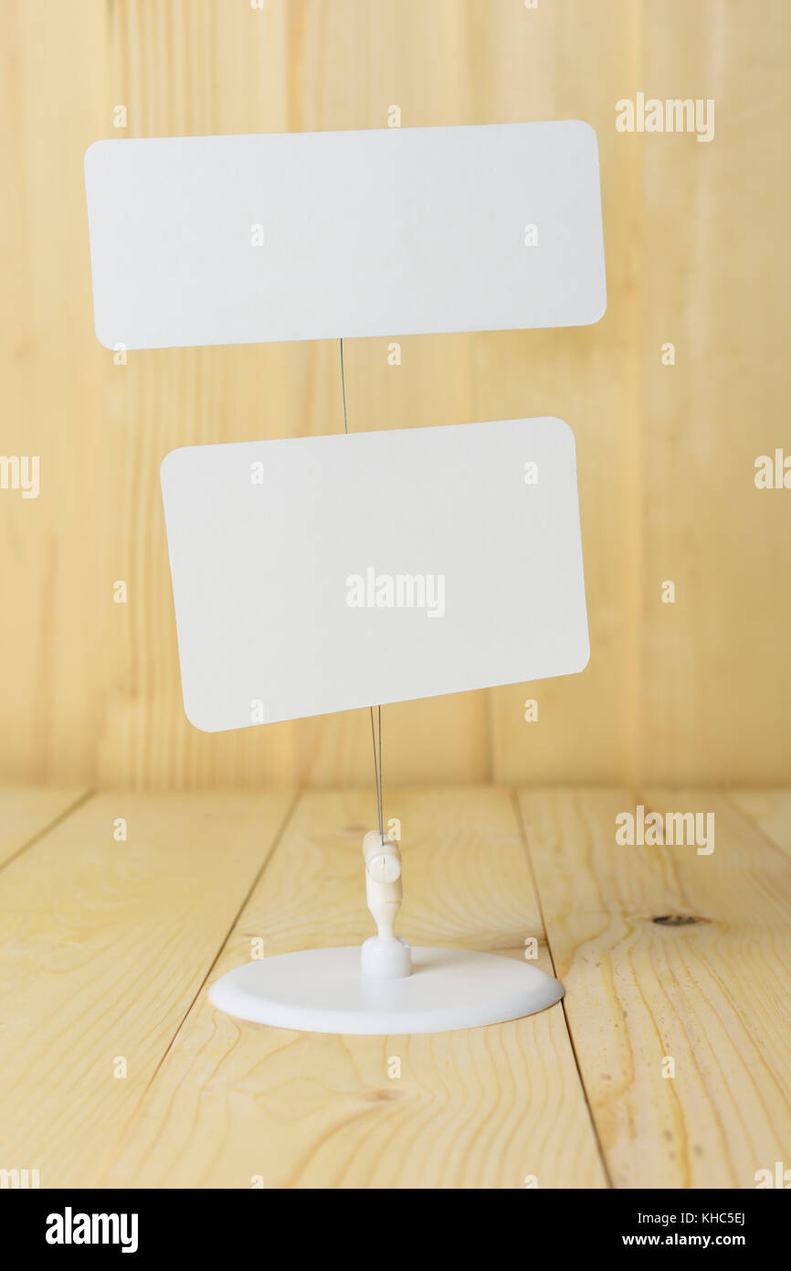 Double white label stand on the wooden table Stock Photo - Alamy