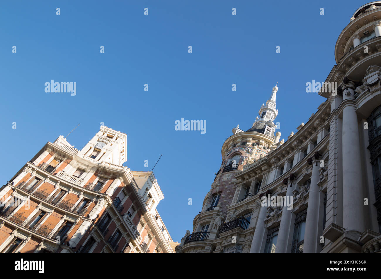 Facade of a couple of buildings in a square of Madrid (Spain), taken ...