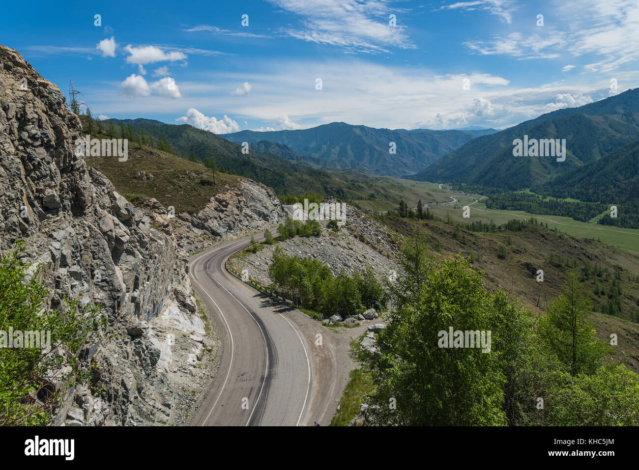 Scenic top view on the valley between the mountains, road, hills ...