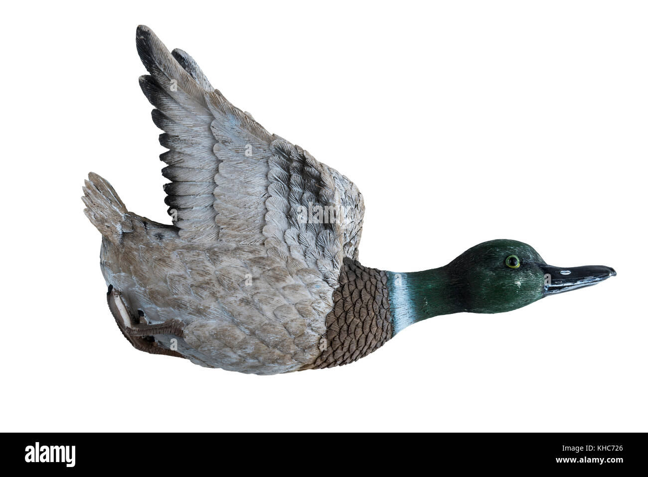 Cast resin flying wall hanging duck, placed on a sky background Stock ...