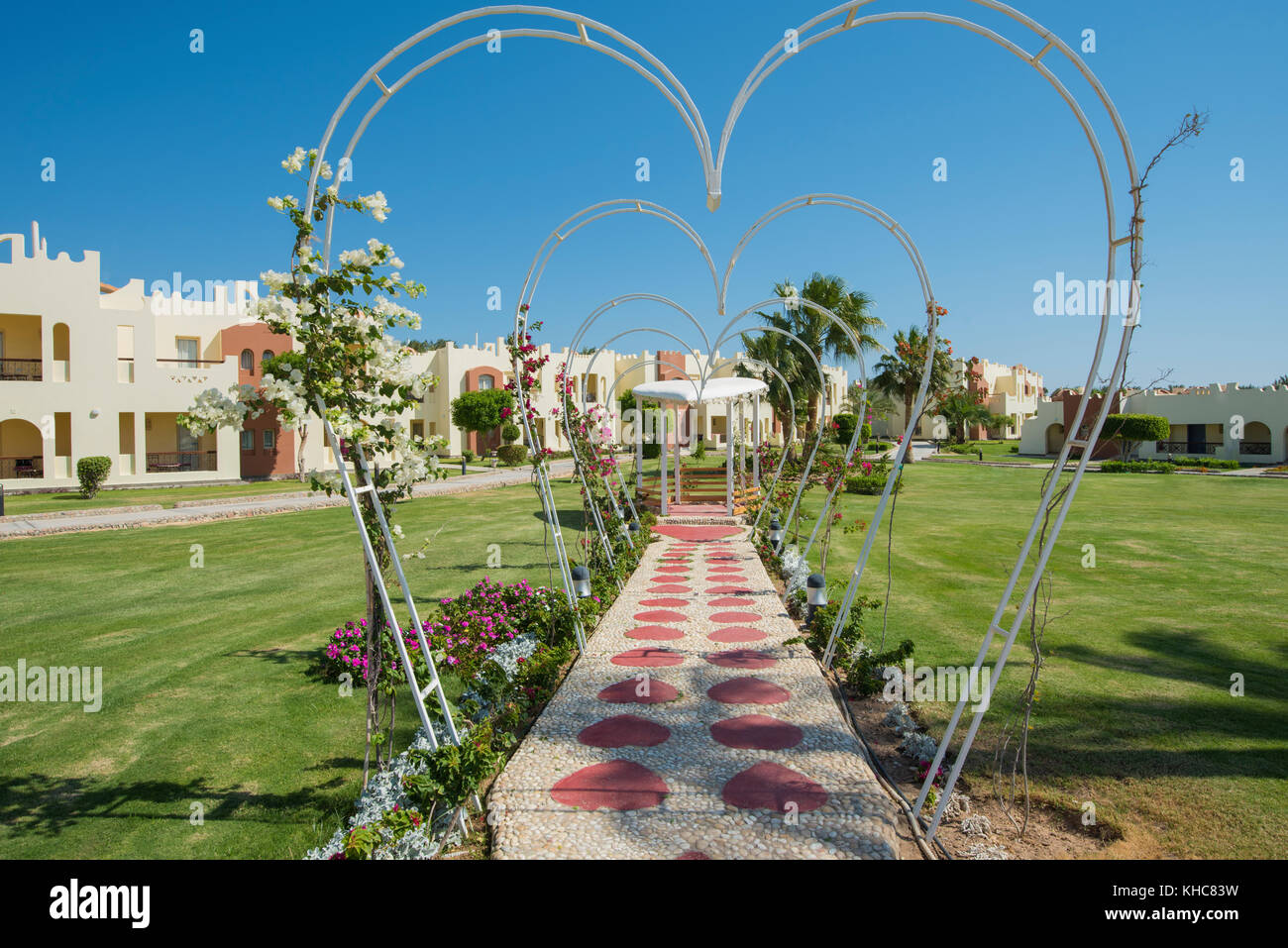Formal landscaped gardens in grounds of a luxury tropical hotel resort ...