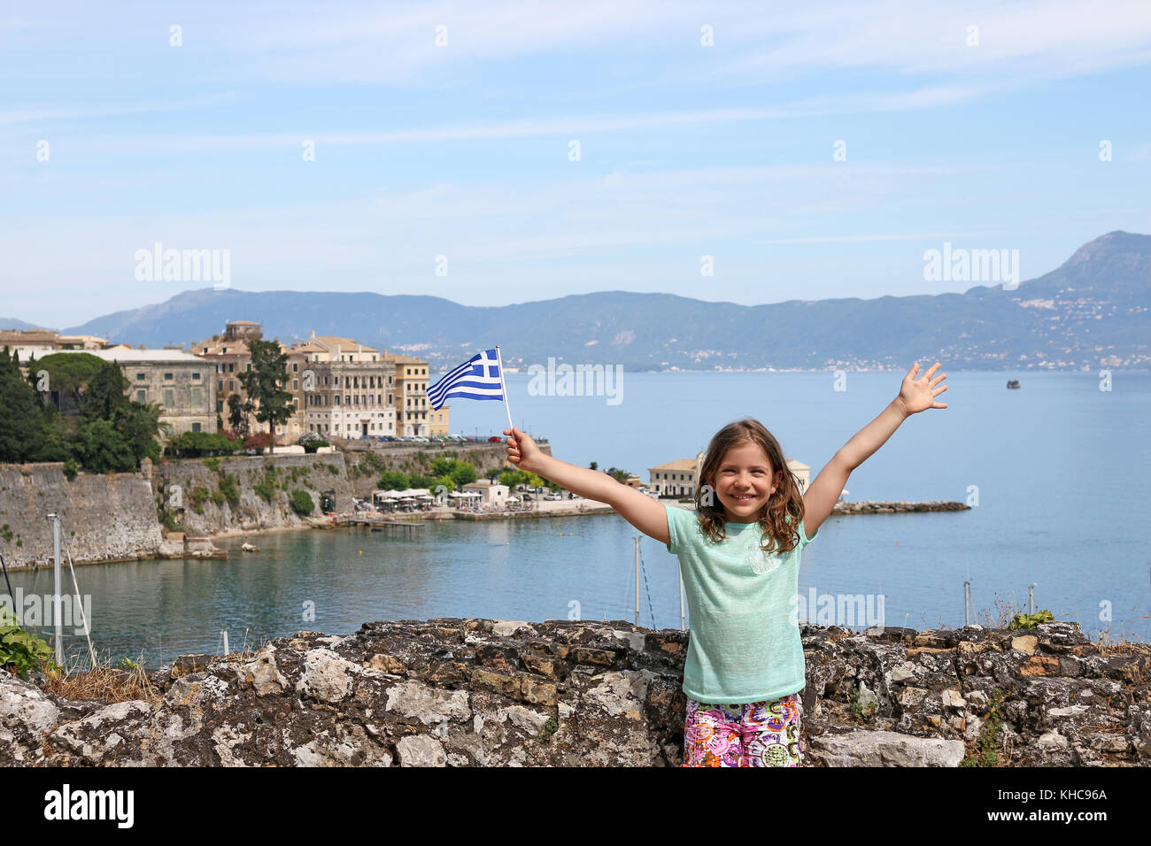 happy little girl with Greek flag on summer vacation Corfu town Stock ...