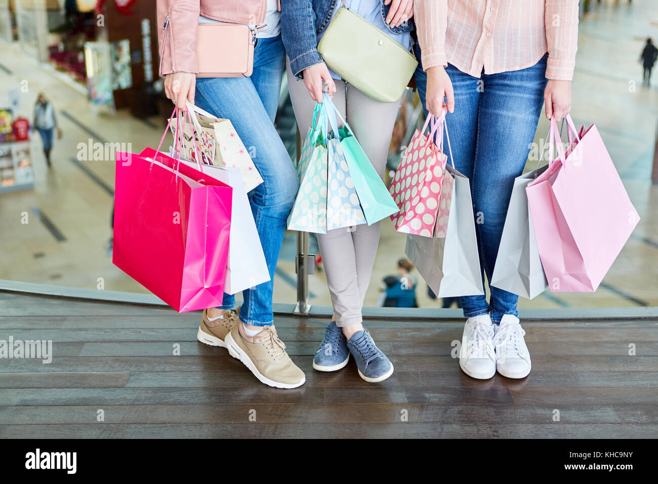 Female customer with many shopping bags in shopping mall Stock Photo ...
