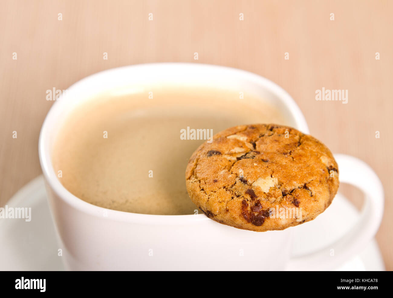 Homemade cookie on the rim of a cup of coffee Stock Photo - Alamy