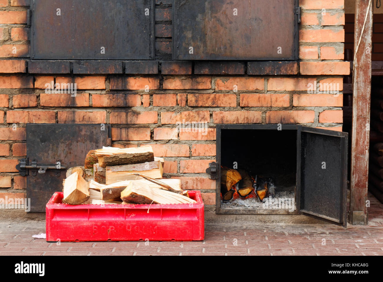 Smokehouse with wood and fire Stock Photo - Alamy