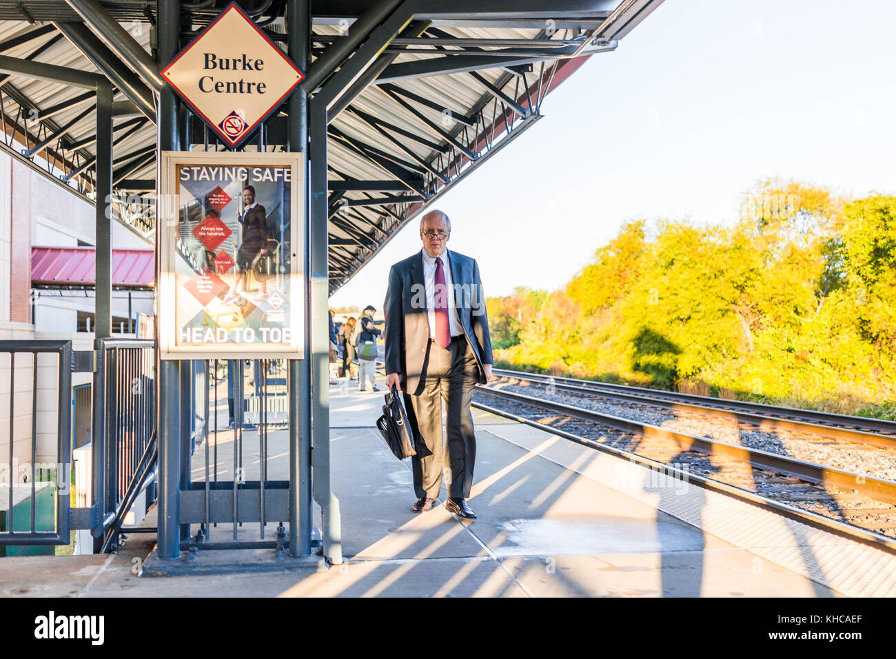 Burke, USA - October 27, 2017: Businessman man walking on platform for ...