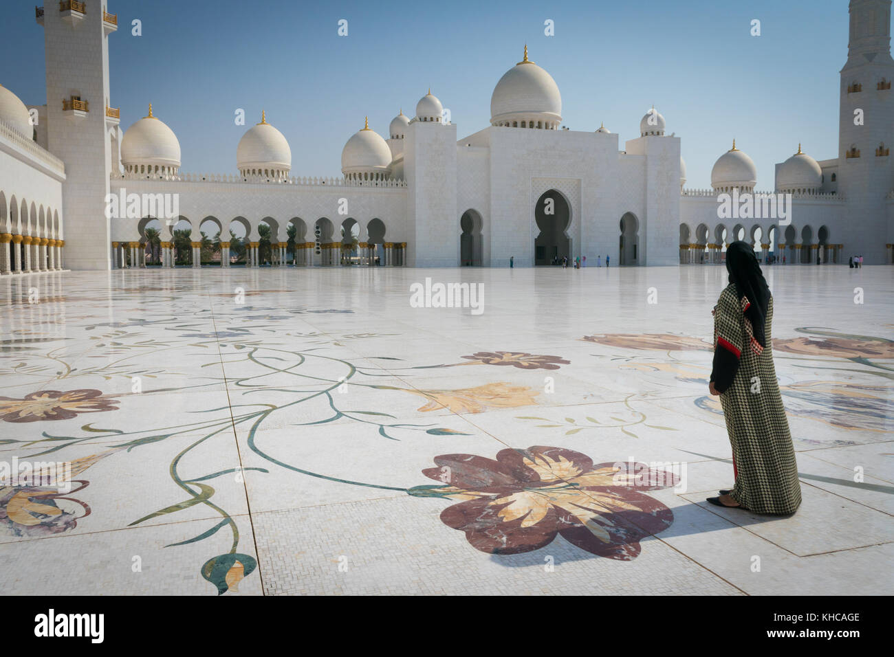 A visitor admires the architecture of the Sheikh Zayed Grand Mosque in ...