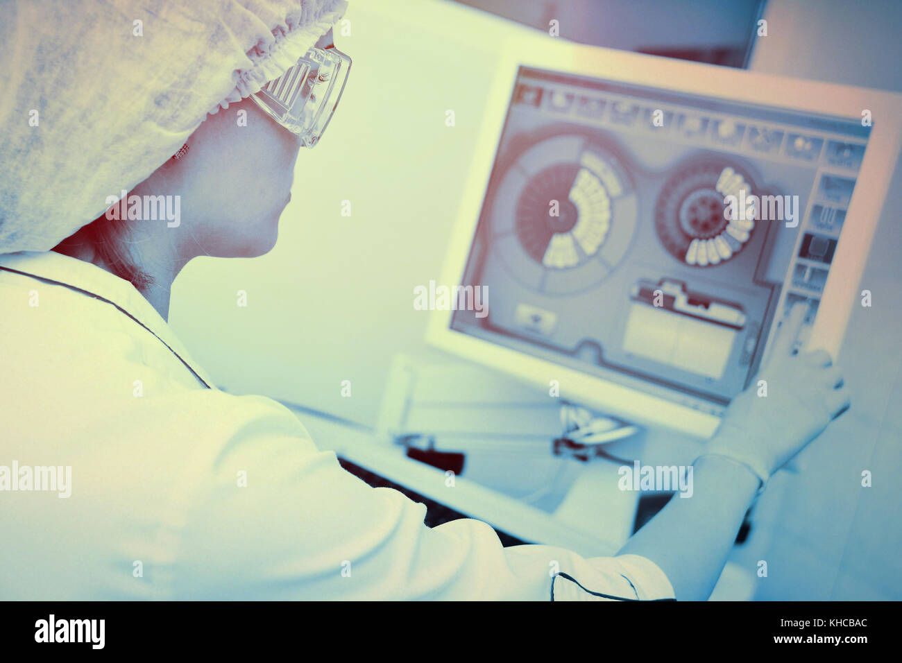 lab assistant presses the touch screen monitor in the laboratory Stock ...