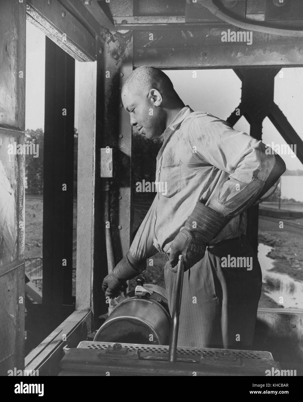 African American steel worker working with machinery outdoors, 1942 ...