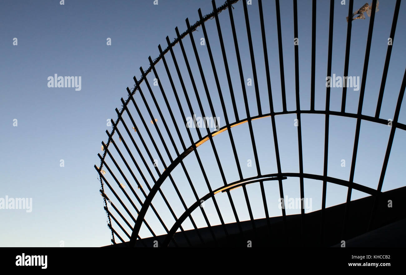 Detail of border gate in the evening Stock Photo - Alamy