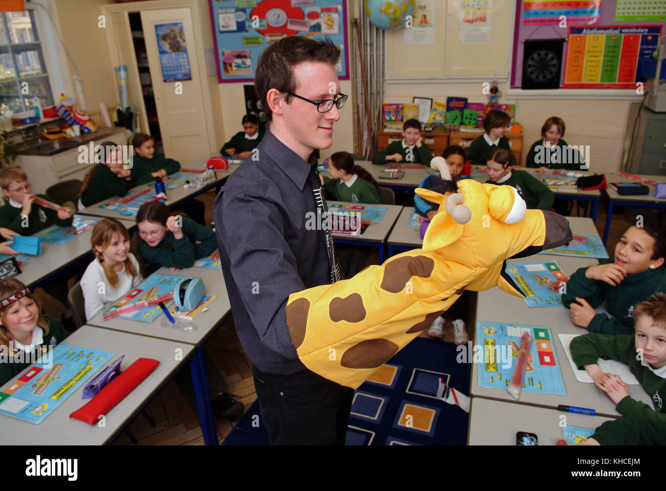 Teacher David Millington uses puppets, Gerald the Giraffe and Vinny the ...