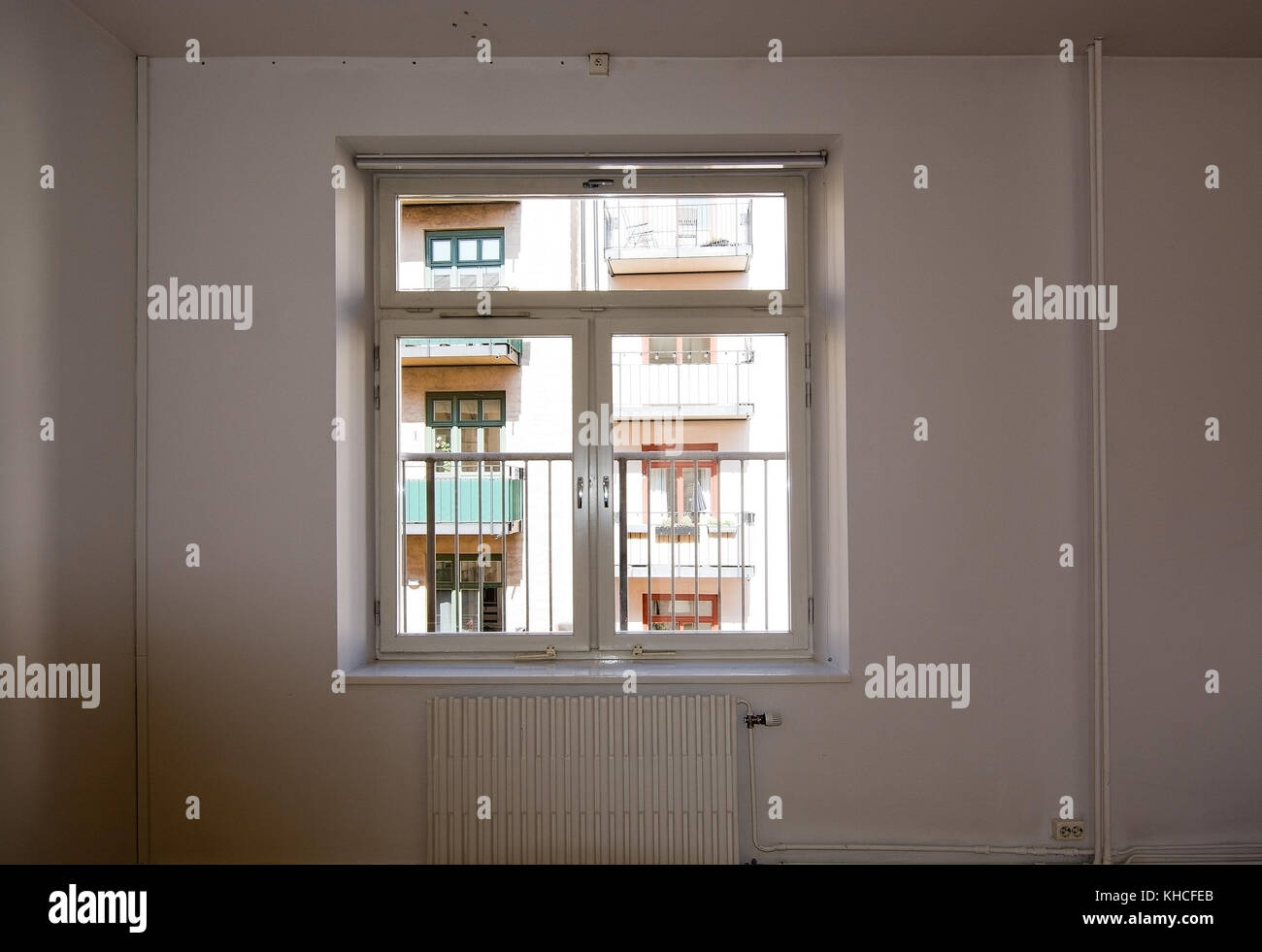 White room shabby interior with window view on typical 1900 building in ...