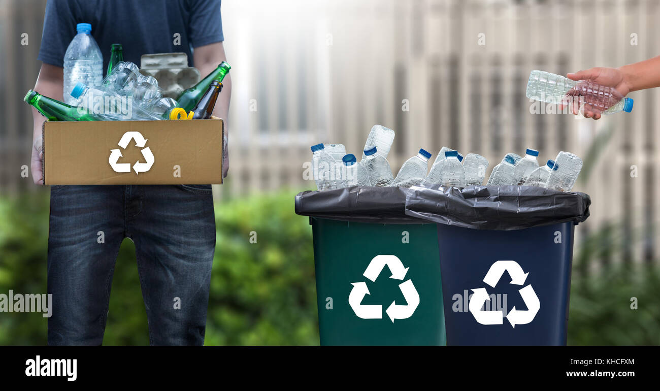 man hand putting plastic reuse for recycling concept environmental ...