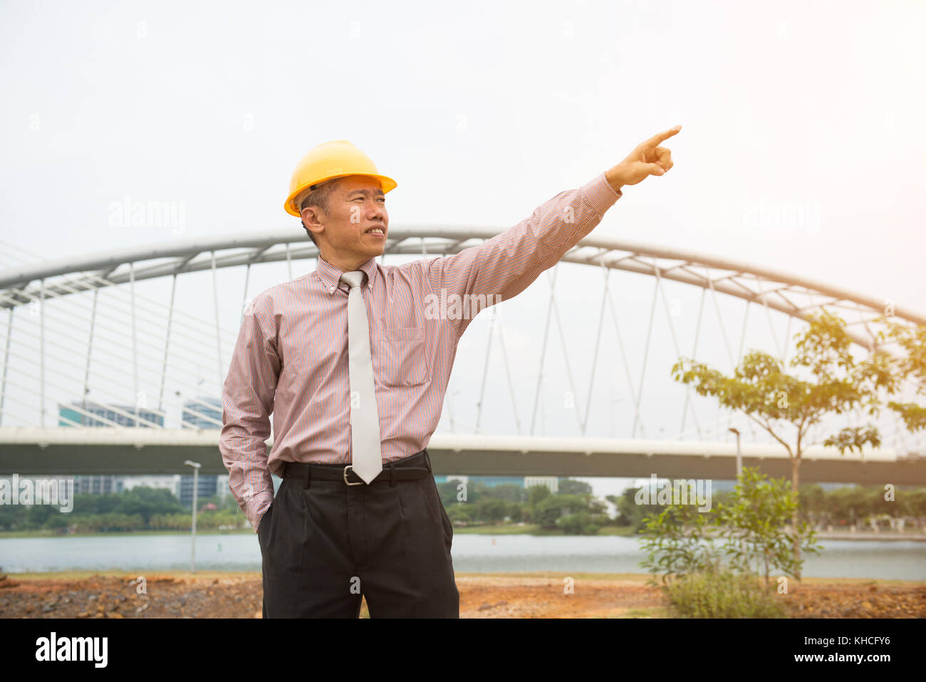 asian senior business architect pointing somewhere Stock Photo - Alamy
