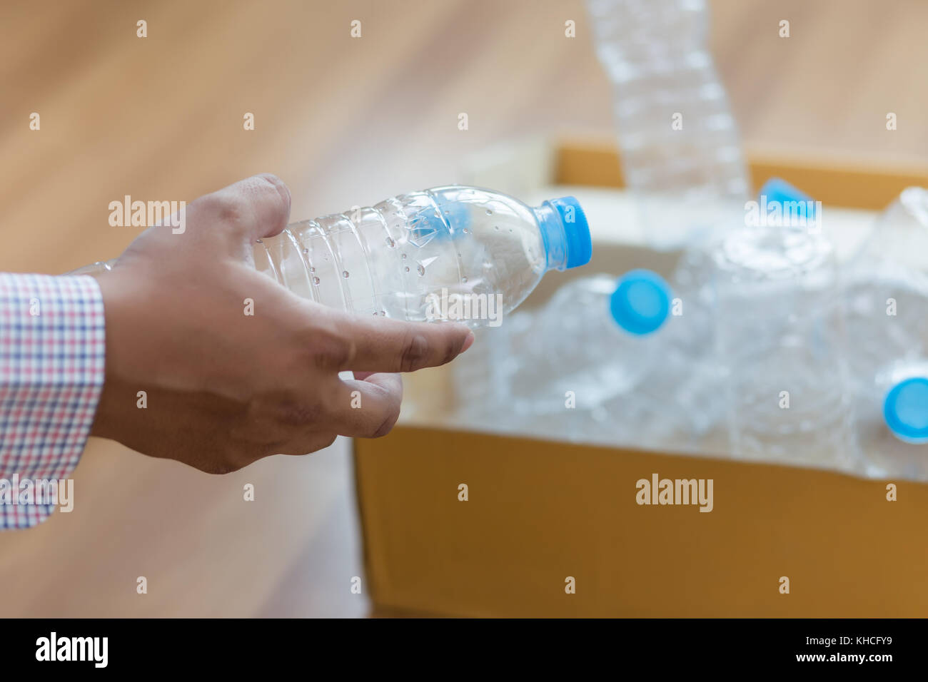 man hand putting plastic reuse for recycling concept environmental ...
