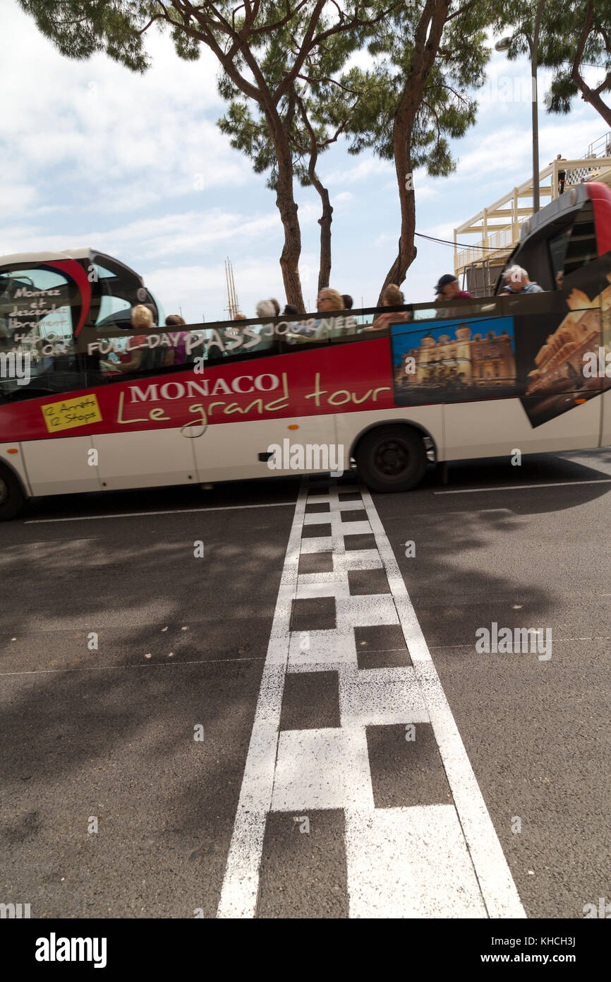 Monaco, tourist tour bus passing over the start/finish line of the ...