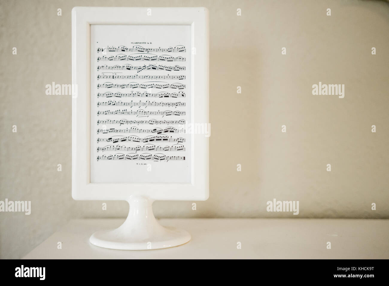 Old sheet music in simple white frame (Mozart, copyright expired, now ...
