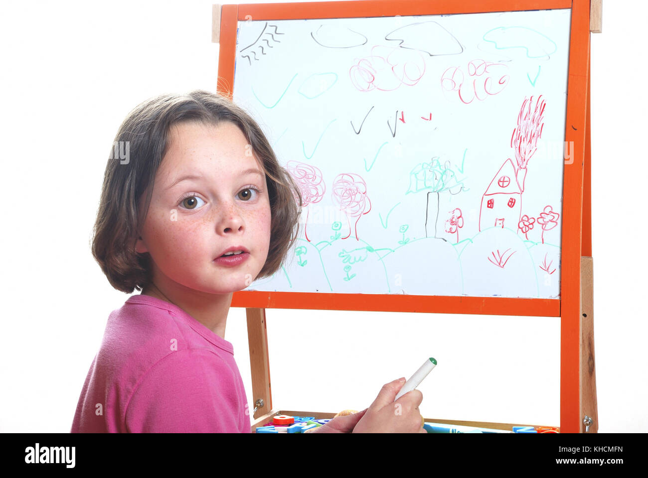 Young girl drawing on the white board Stock Photo - Alamy