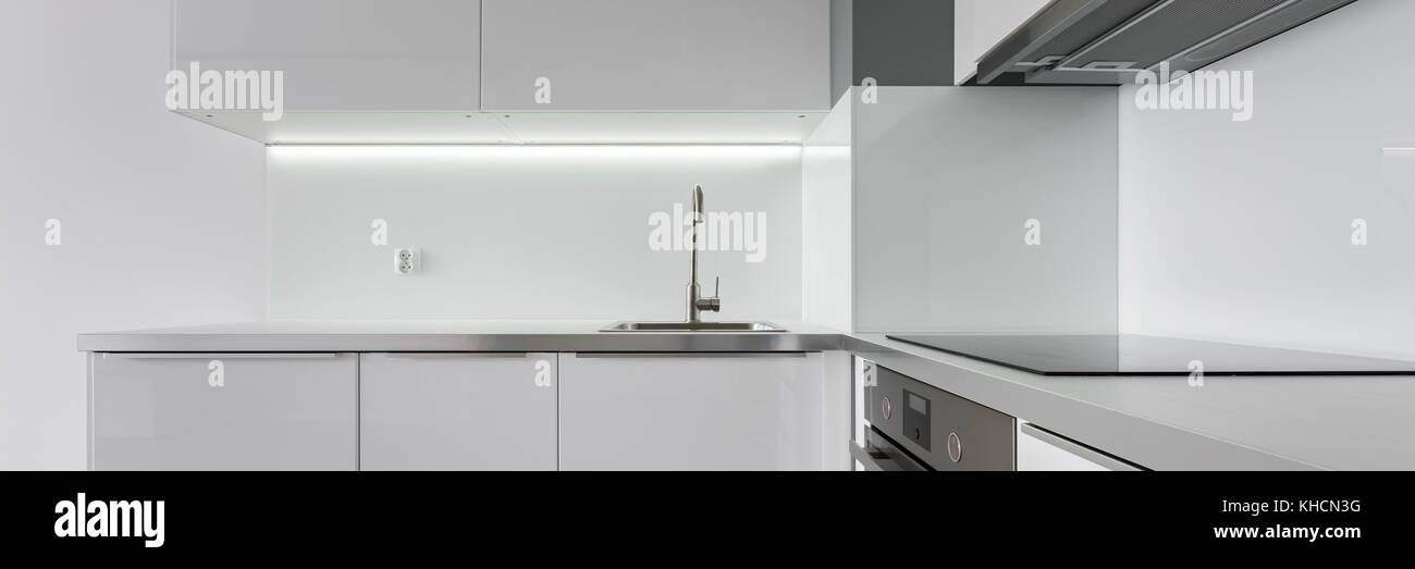 Panoramic view of modern kitchen with white furniture Stock Photo - Alamy