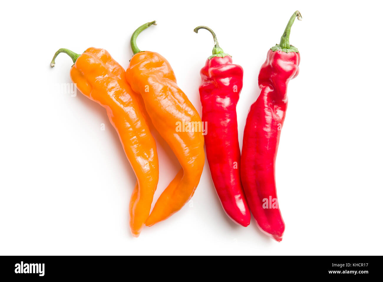 Orange and red peppers isolated on white background Stock Photo - Alamy