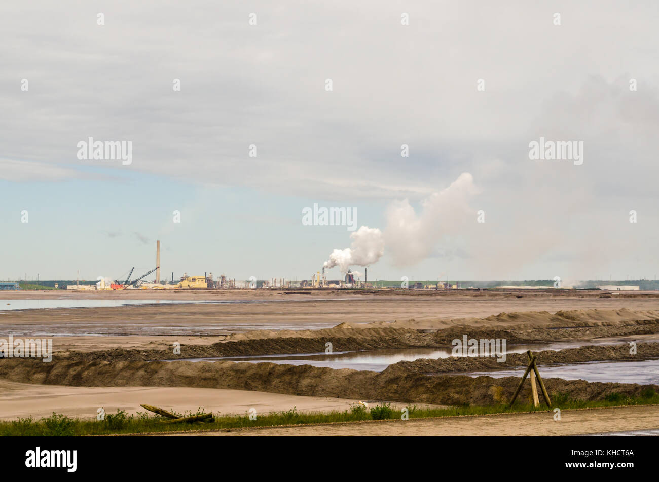 The largest Canadian oil refinery in the background, oil sand in the ...