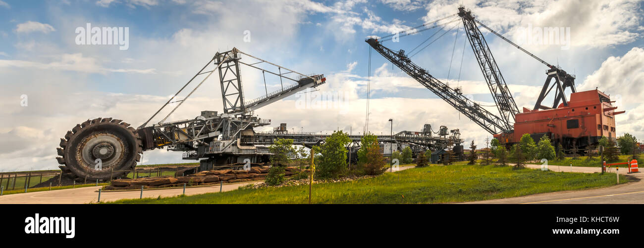 Heavy equipment for oil sands industry, red crane and huge digger Stock ...