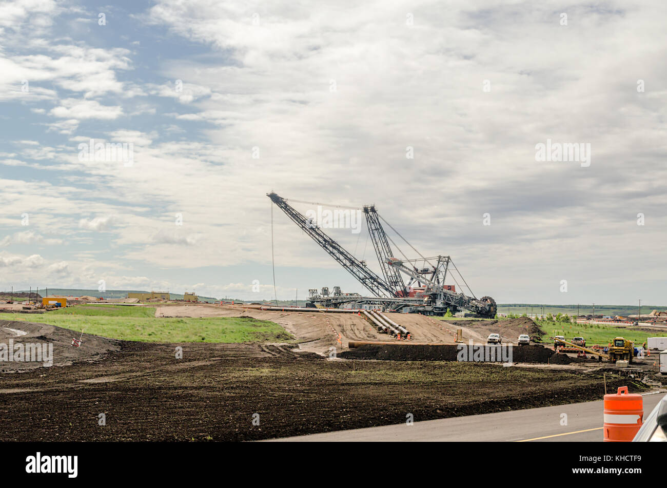 Heavy equipment for oil sands industry, red crane and huge digger ...