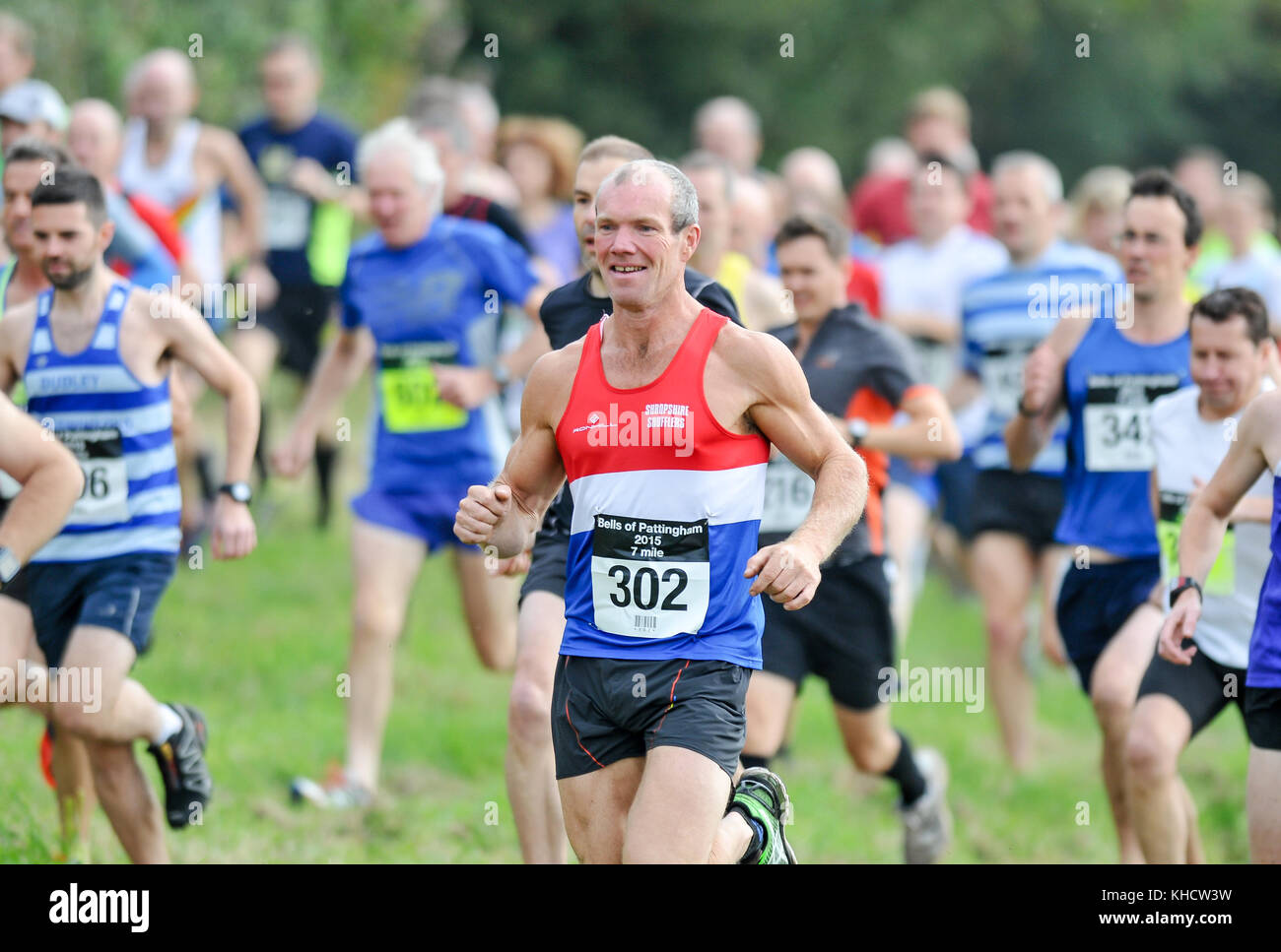 Male cross country runner after leaving the start line of a race in ...