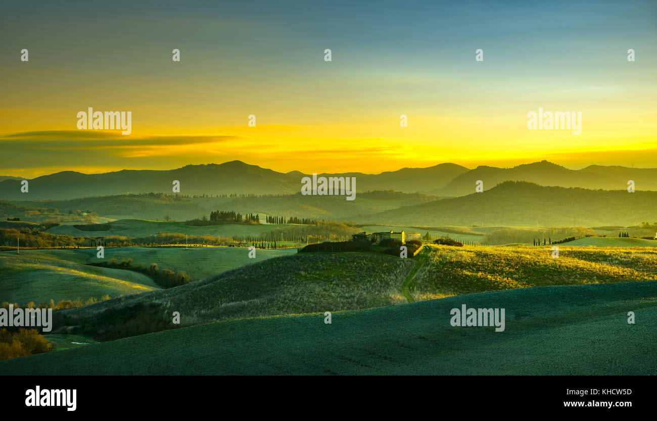 Volterra panorama, rolling hills and green fields at sunset. Tuscany ...