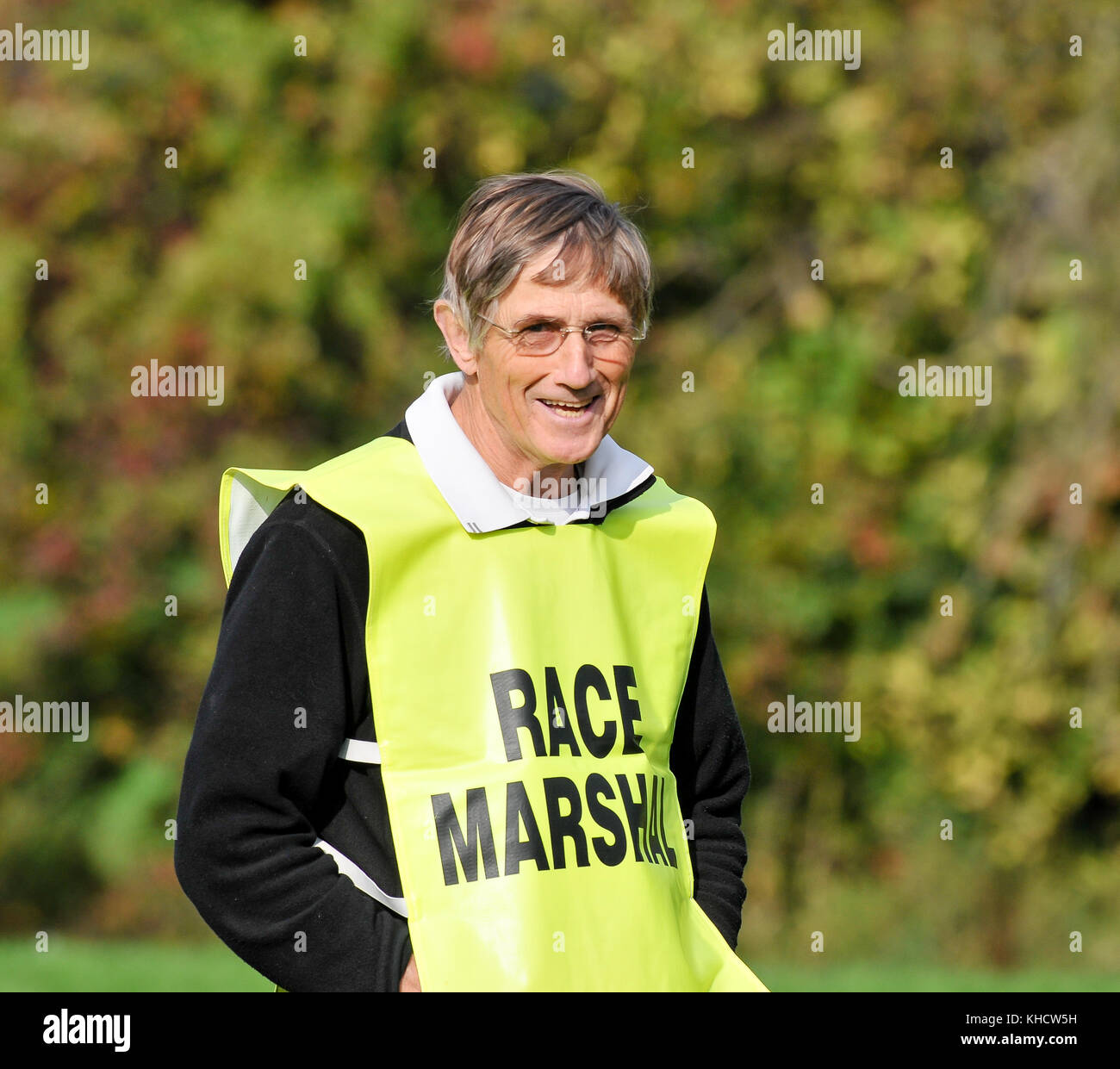 Race marshall at a cross country running event, Staffordshire, England ...